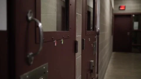 Prison cell door in prison hallway. Inte... | Stock Video | Pond5