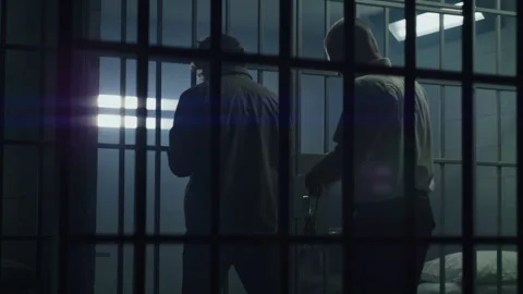 Prison guard opens jail cell with keys a... | Stock Video | Pond5