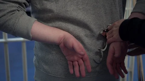Prison Guard Puts Handcuffs On Inmate, 4... | Stock Video | Pond5