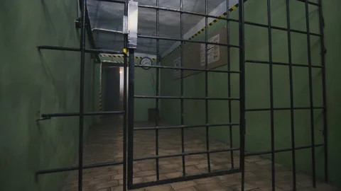 A prison guard in tactical uniform is op... | Stock Video | Pond5