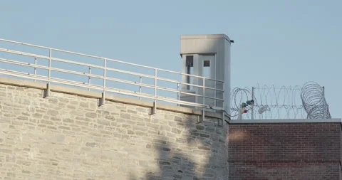 Prison Guard Tower and Razor Wire | Stock Video | Pond5