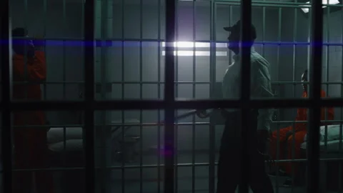 Prison officer comes to jail cells and b... | Stock Video | Pond5