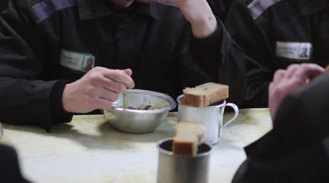 prisoners eating lunch close-up Russia | Stock Video | Pond5