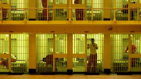 Prisoners serve time in large cell block... | Stock Video | Pond5