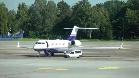 A private jet standing on the tarmac at ... | Stock Video | Pond5