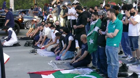 pro-Palestinian protesters praying on st... | Stock Video | Pond5