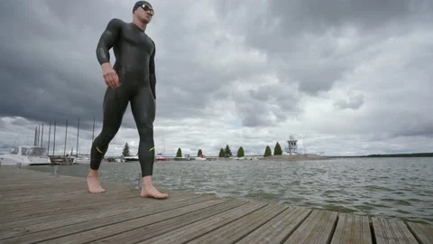 Pro swimmer, triathlete in a wetsuit swi... | Stock Video | Pond5