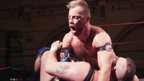 Pro wrestler hits flying crossbody dive ... | Stock Video | Pond5