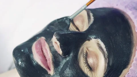 Procedure for applying a black mask to t... | Stock Video | Pond5