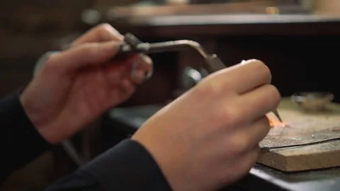 Process annealing a silver ring using a ... | Stock Video | Pond5