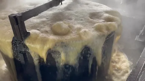 The process of boiling sugar cane juice | Stock Video | Pond5
