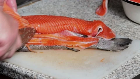 The process of cutting the fish trout. C... | Stock Video | Pond5