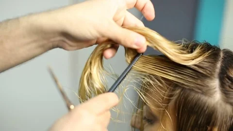 Process of cutting hair | Stock Video | Pond5