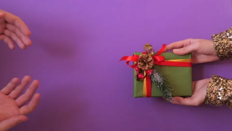 Process of giving a gift on lilac backgr... | Stock Video | Pond5