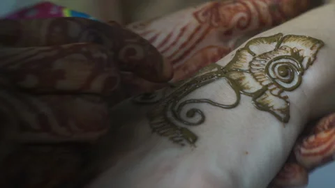 Process of henna tattoo. The artist is p... | Stock Video | Pond5