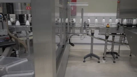 The process of labeling bottles of dairy... | Stock Video | Pond5