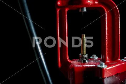 The process of making a rifle cartridge. Hand press and ammo shell ...