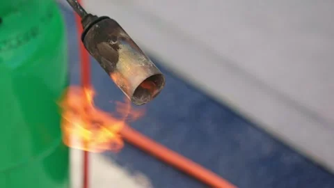 Process of melting roll of tar onto the ... | Stock Video | Pond5