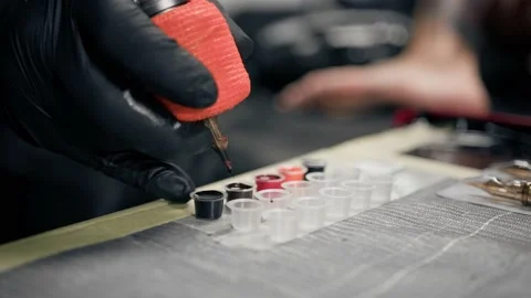 The process of pouring tattoo ink into a... | Stock Video | Pond5
