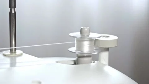The process of winding white thread on t... | Stock Video | Pond5