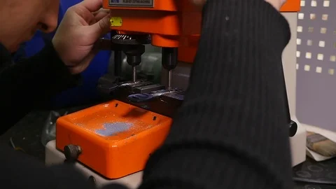 Production of keys. Making a copy of the... | Stock Video | Pond5