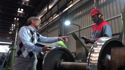 Production Manager Talking to Black CNC ... | Stock Video | Pond5