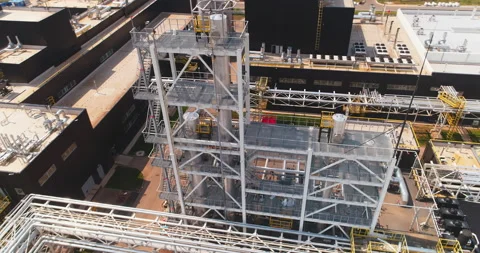 Production tower with pipes and grounds ... | Stock Video | Pond5