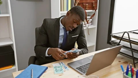 A professional black man multitasking in... | Stock Video | Pond5