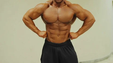 Professional bodybuilder demonstrating s... | Stock Video | Pond5