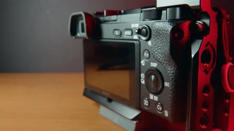 Professional camera on a table with red ... | Stock Video | Pond5