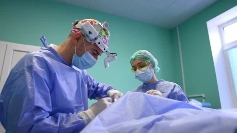 Professional doctor making incision usin... | Stock Video | Pond5