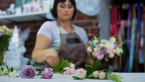 professional florist arranging flower we... | Stock Video | Pond5