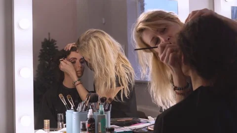 a professional make-up artist does the m... | Stock Video | Pond5