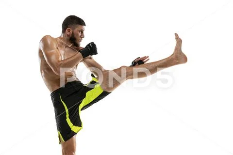 Professional male MMA boxer in motion isolated on white studio ...