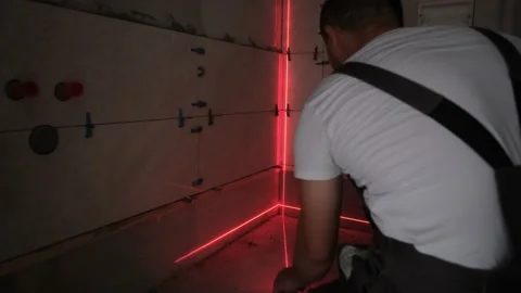 A professional master lays ceramic tiles... | Stock Video | Pond5