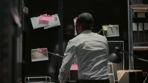 Professional police officer hanging clue... | Stock Video | Pond5