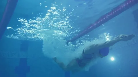 Professional Swimmer Jumping into Swimmi... | Stock Video | Pond5