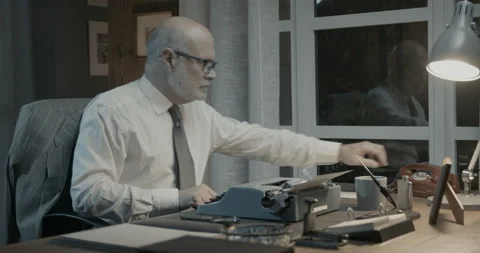 Professor sitting at desk and having a p... | Stock Video | Pond5