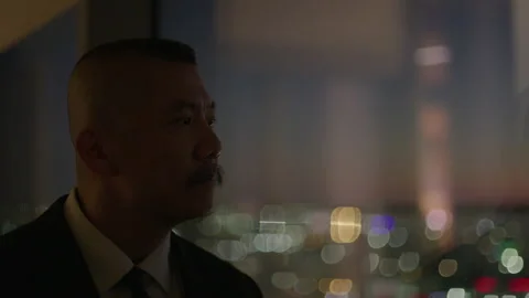 Profile of a Businessman in an Office Bu... | Stock Video | Pond5