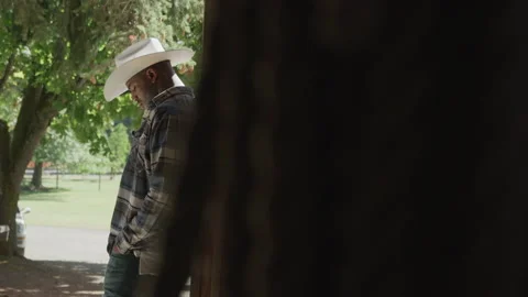 Profile of a Cowboy Leaning Against a Ba... | Stock Video | Pond5