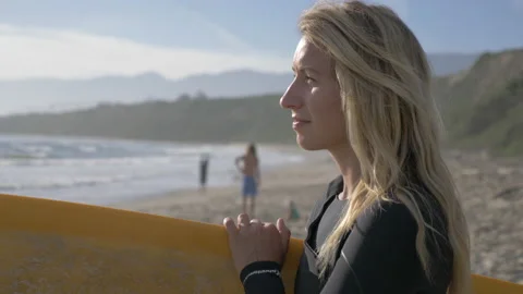 Profile of a Female Surfer at the Beach | Stock Video | Pond5
