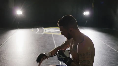 Profile of an Mma Fighter Strapping on B... | Stock Video | Pond5