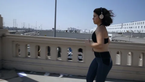 Profile running shot of woman running th... | Stock Video | Pond5