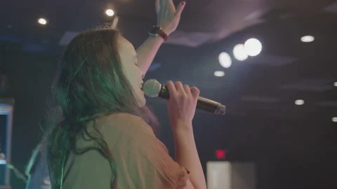 Profile of a Woman Singing on a Stage an... | Stock Video | Pond5