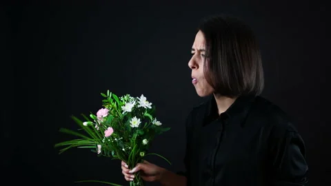 Profile of Young Woman Biting Flower Fro... | Stock Video | Pond5