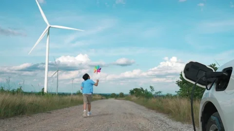 Progressive young boy playing windmill t... | Stock Video | Pond5