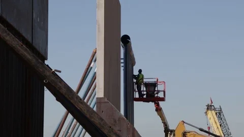 Prototype walls taking shape, crew membe... | Stock Video | Pond5