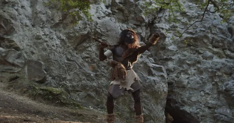 Proud black caveman holding weapon neand... | Stock Video | Pond5