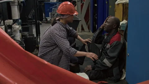 Providing First Aid to Factory Worker af... | Stock Video | Pond5