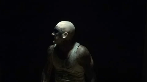 Psycho bald horror man in black room | Stock Video | Pond5